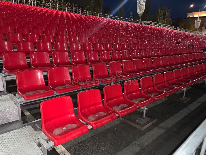 Bright red stadium seats stock photo. Image of pitch - 251177526