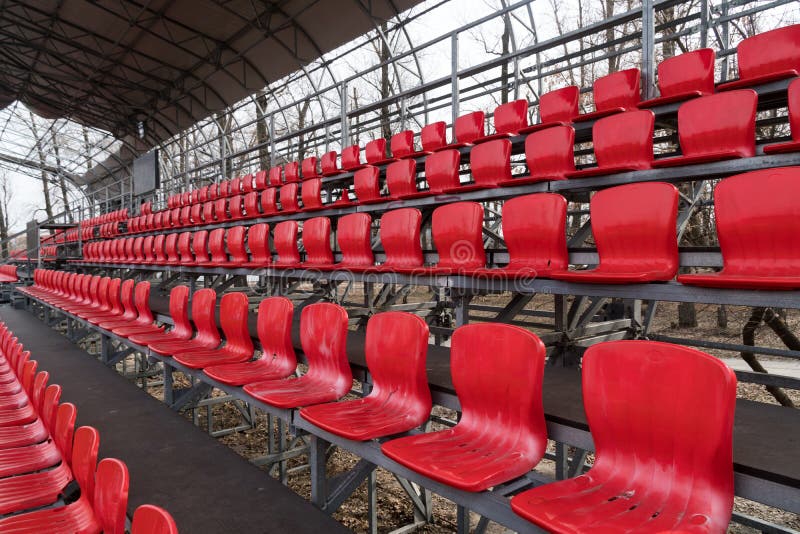 Bright red stadium seats stock photo. Image of public - 89795804