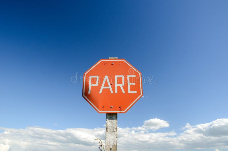 Bright Red Stop Sign Under a Clear Blue Sky Stock Image - Image of ...