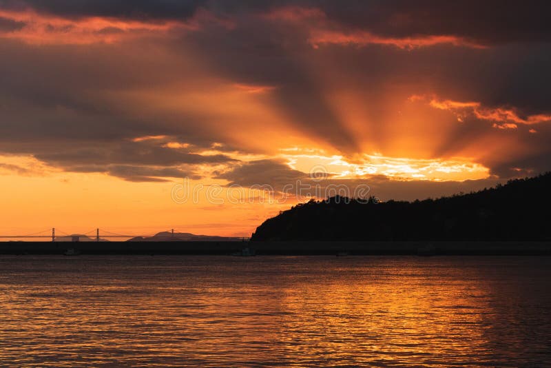 Bright Red Sun Rays of the Sunset Hitting the Clouds and Reflecting Off ...