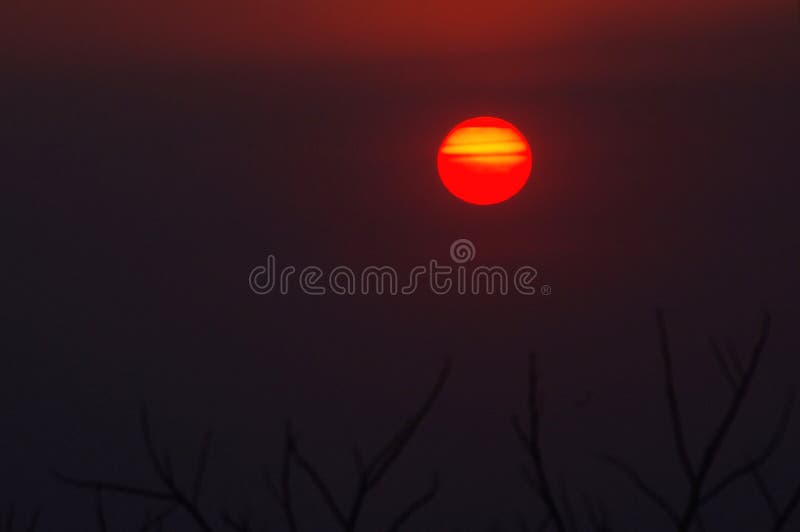Bright red sunrise stock image. Image of evening, wood - 60392423