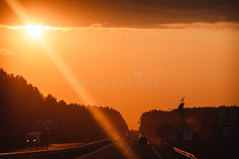 Bright Red Sunset Over the Track. Road To the City Stock Photo - Image ...