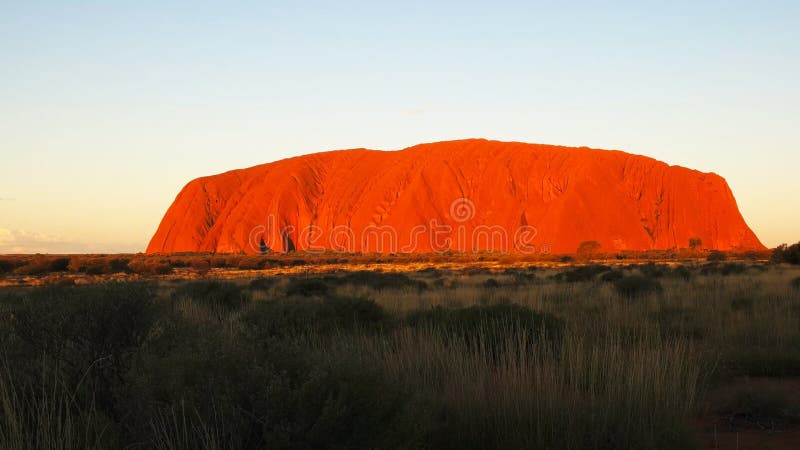 Bright red uluru at sunset stock video. Video of park - 133641089