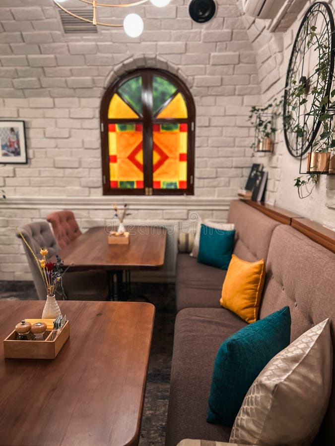 Bright Restaurant Hall with Tables and Chairs Against the Background of ...