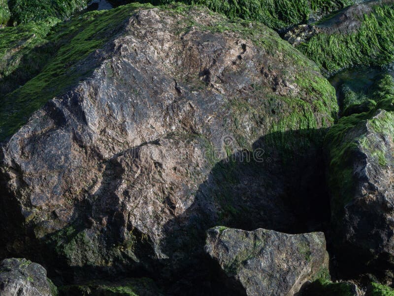 Bright Red Rocks Forming Barrier Along Charlottetown Harbour Stock ...