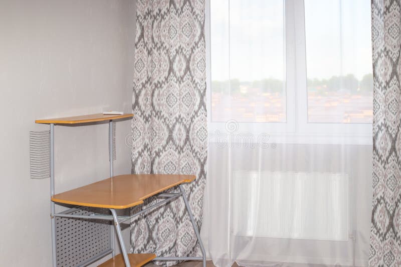 Bright Room with a Curtained Window, a Computer Desk Near a Gray Wall ...