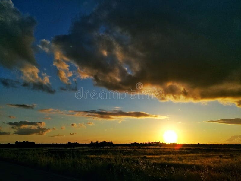 Bright Scenery of Sunset Over the Meadows Stock Image - Image of sunset ...