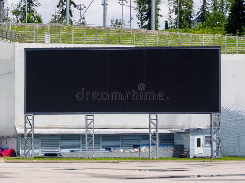 A Bright Screen in the Stadium Shows Exciting Moments of the Game ...