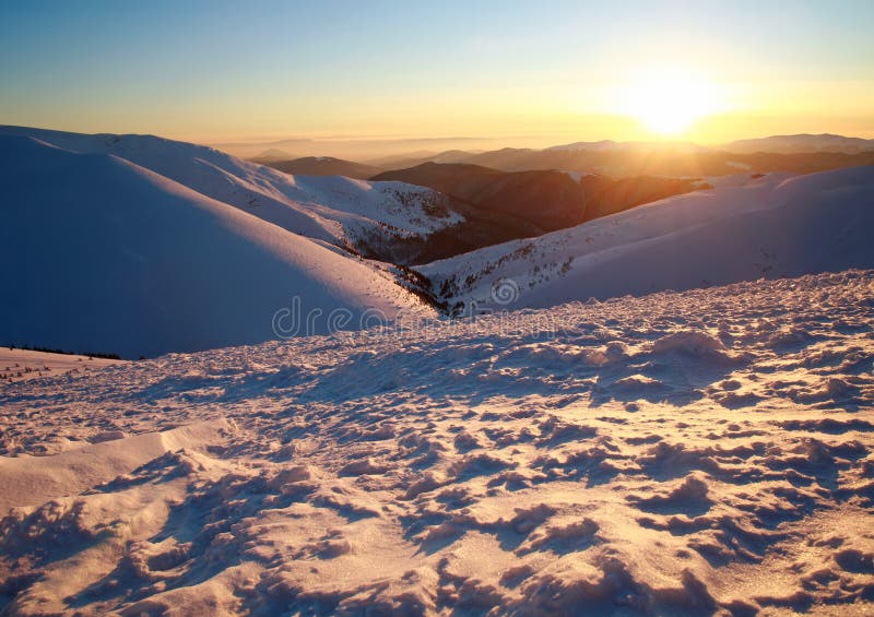 Bright Setting Sun in Winter Snowy Mountains Stock Photo - Image of ...