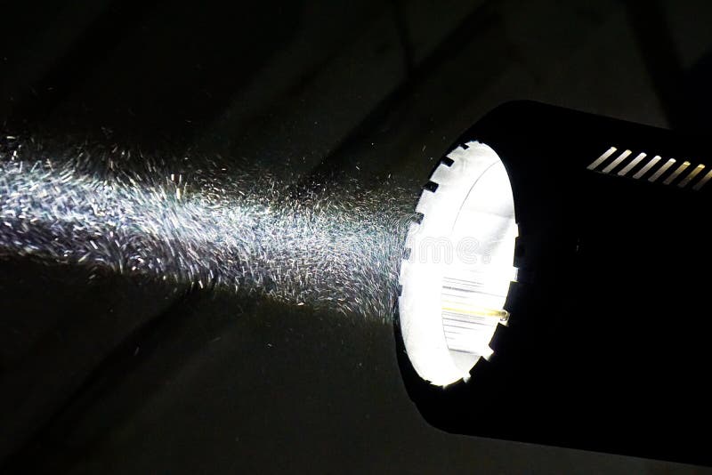 Bright Spotlight on a Black Background, the Beam Highlights the Dust ...