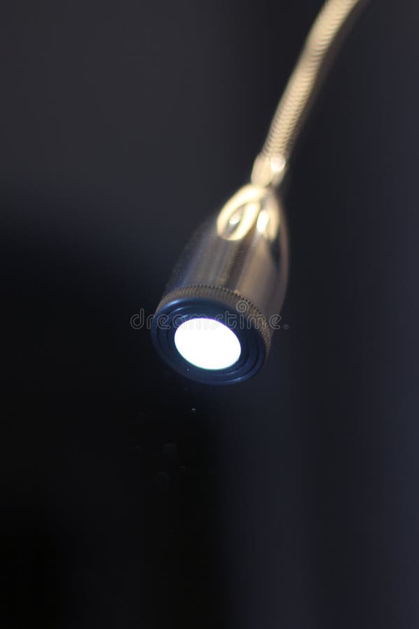 Single Reading Lamp Shining a Bright Spotlight in the Dark Stock Image ...