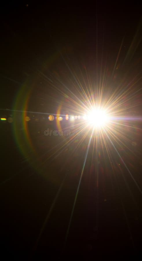 Bright Starburst Lens Flare on Black Background Stock Illustration ...
