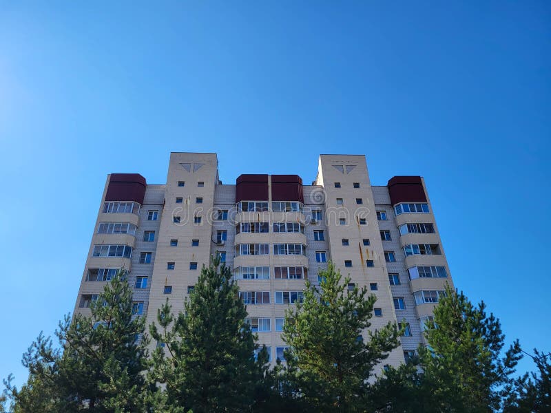 Bright Sun and Blue Sky on Their Background is a Beautiful High-rise ...