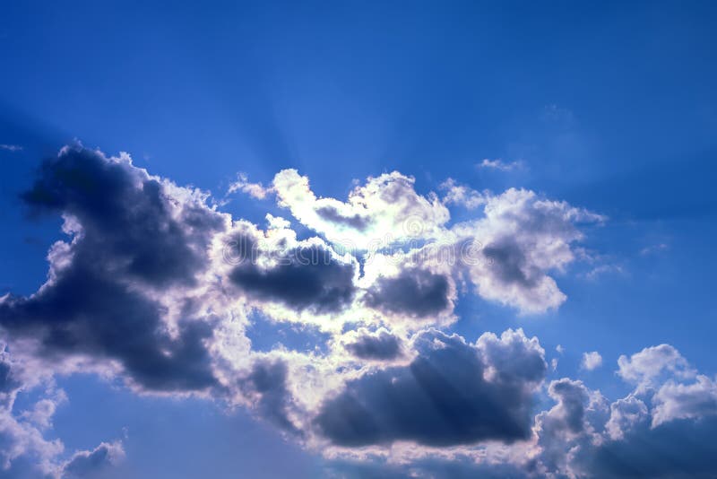 The Bright Sun Breaks through the White Cloud, the Rays of the Sun ...