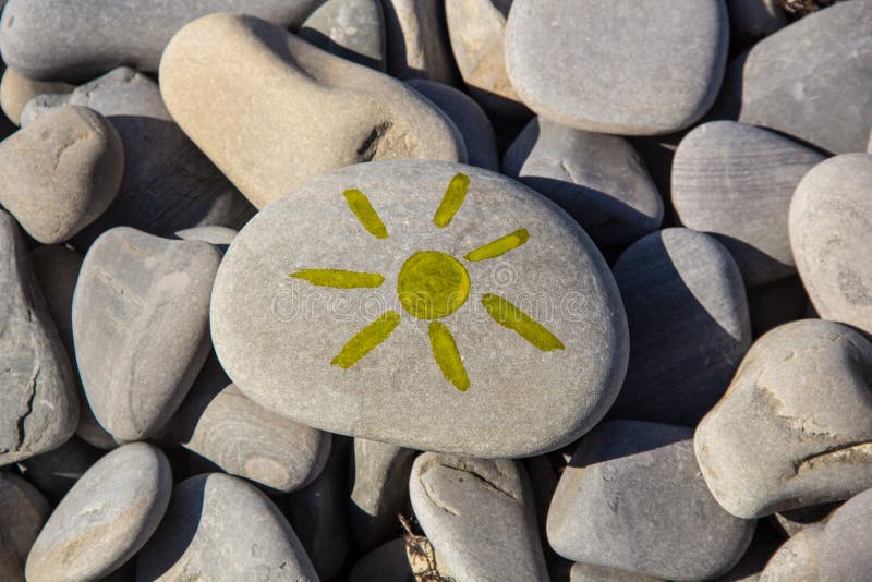 Bright Sun Painted on Pebble. Pebbles Background Stock Image - Image of ...