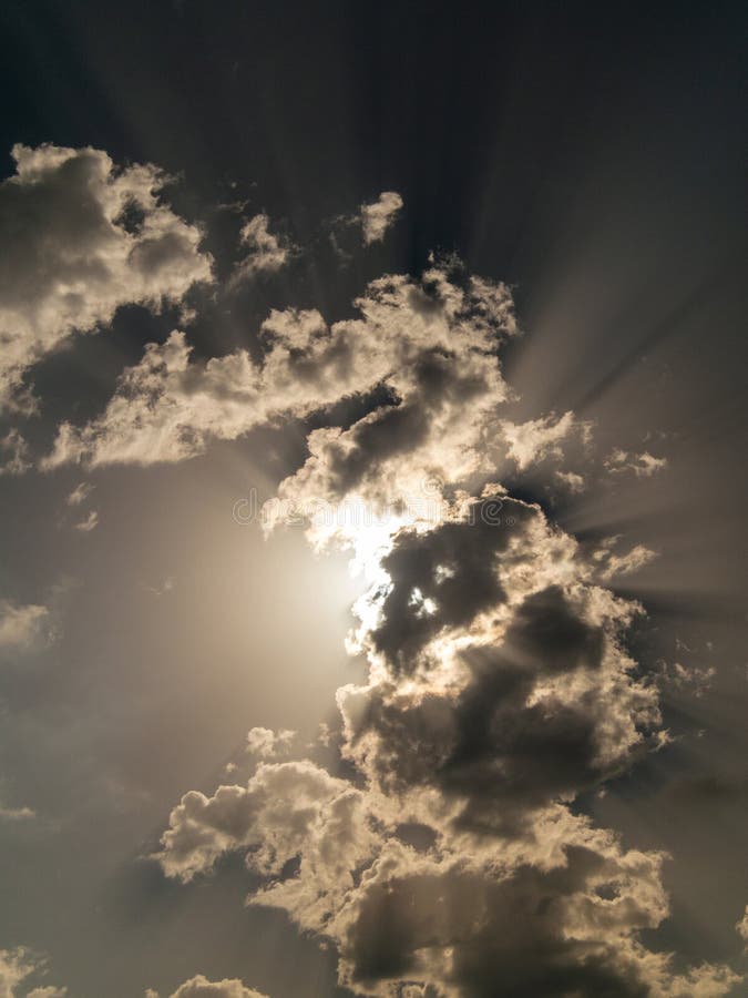 Bright Sun Rays Burst through the Dark Clouds Stock Photo - Image of ...
