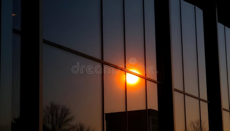 A Bright Sun Reflecting on the Glass Windows of a Building Stock ...