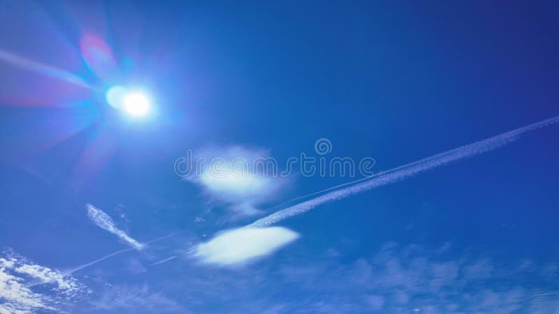 Timelapse of a Bright Sun Shining in a Clear Blue Sky with Fluffy ...
