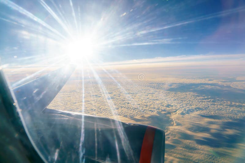The Bright Sun Shining in the Window of an Airplane Stock Image - Image ...