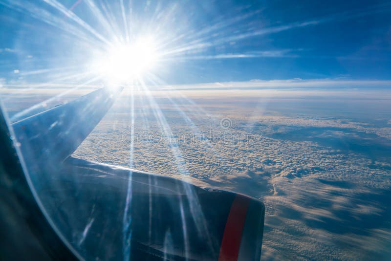 The Bright Sun Shining in the Window of an Airplane Stock Photo - Image ...