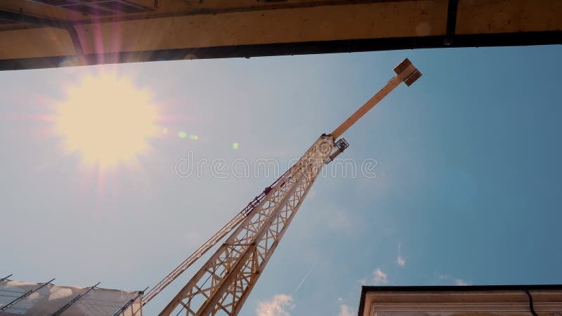 Bright Sunburst Above Construction Crane on a Clear Day, Industrial ...