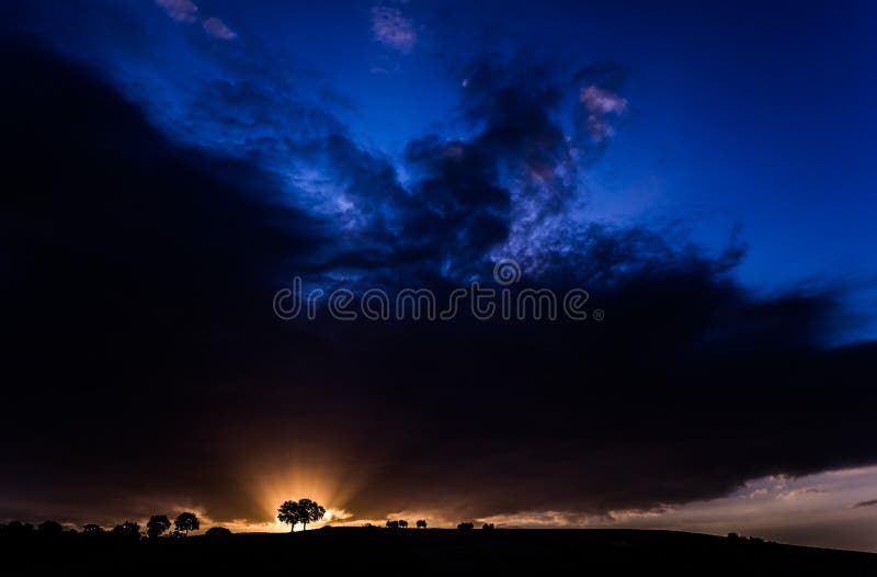Bright Sunlight through Dark Clouds Stock Photo - Image of dreamy ...