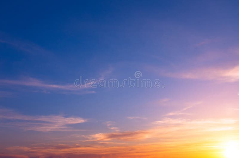 Bright Sunset on a Blue Sky with Bright Sun and Clouds Stock Photo ...