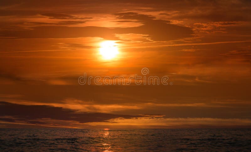 Bright Sunset with Large Orange Sun Above Sea Surface Stock Image ...