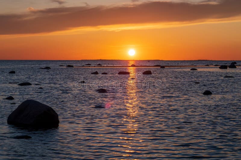 Bright Sunset with Large Yellow Sun Under the Sea Surface. Stock Photo ...
