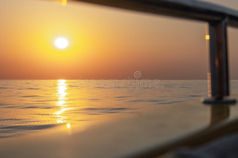 Bright Sunset with Large Yellow Sun Under the Sea Surface. Beautiful ...