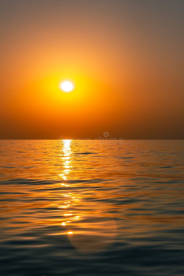 Bright Sunset with Large Yellow Sun Under the Sea Surface. Beautiful ...