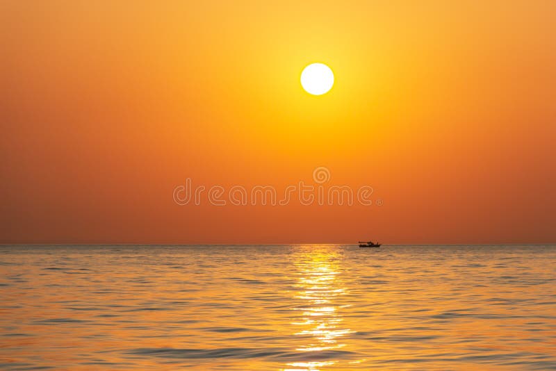 Bright Sunset with Large Yellow Sun Under the Sea Surface. Beautiful ...