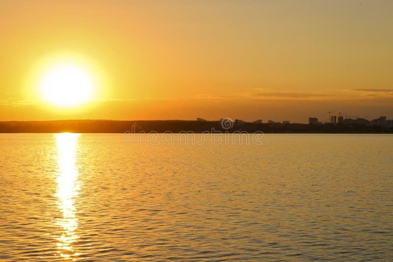 Bright Sunset Over the Lake. Ripples on the Water Stock Photo - Image ...
