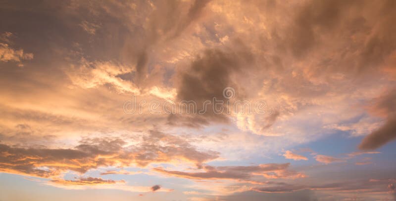 Bright Sunset Scenery with Yellow and Orange Shiny Clouds Stock Image ...