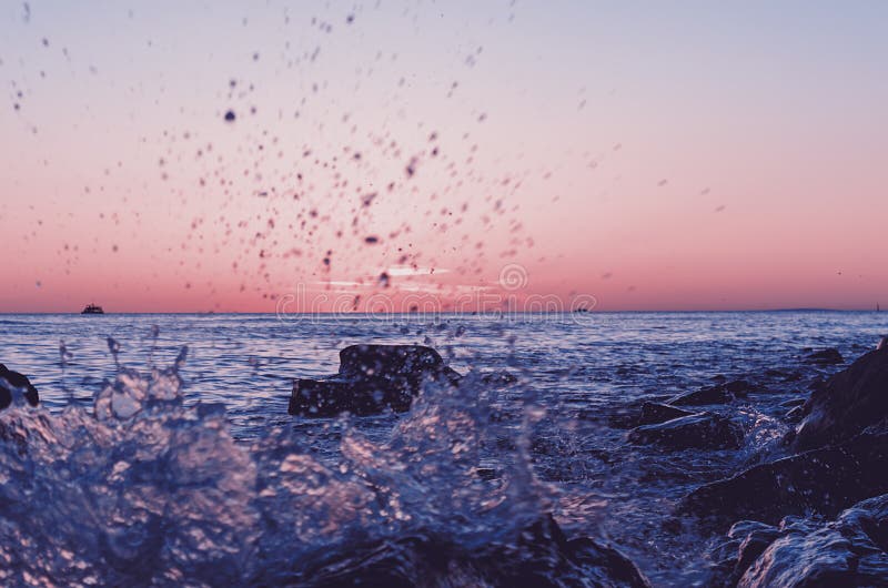 Bright Sunset Under the Sea with Waves Splashes. Stock Photo - Image of ...