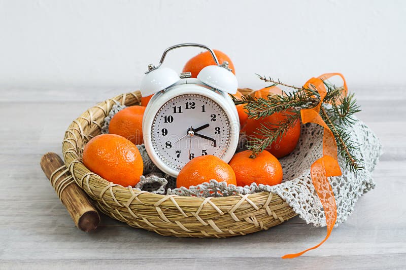 Bright Tangerines on a Decorative Tray with an Alarm Clock, Light ...