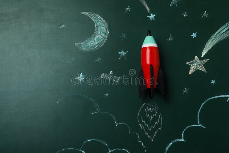 Bright Toy Rocket and Drawings on Chalkboard. Space for Text Stock ...