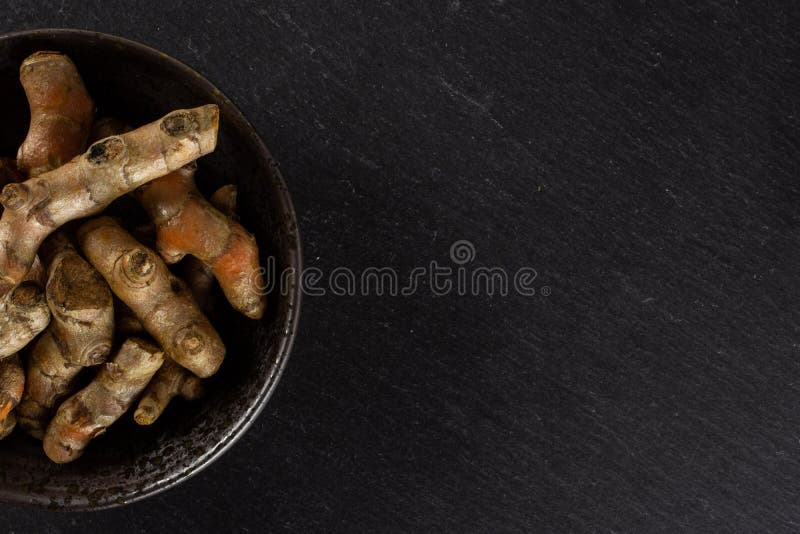 Bright Turmeric Rhizome on Grey Stone Stock Photo - Image of bright ...