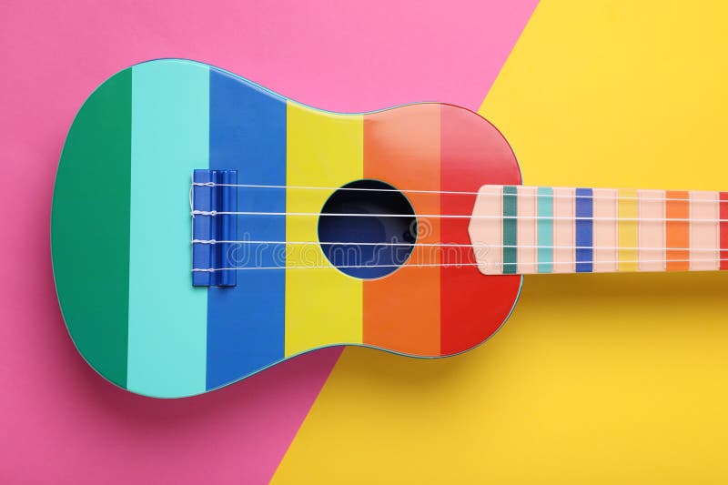 Bright Ukulele on Color Background, Top View. String Musical Instrument ...