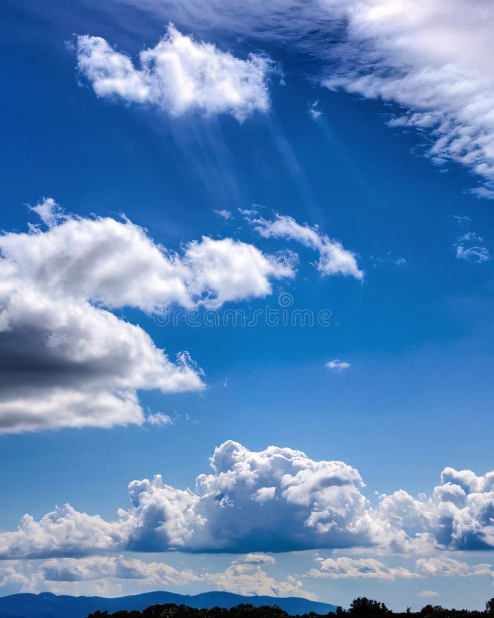 Bright White Clouds Contrast with the Clear Blue Sky. and the Sunlight ...