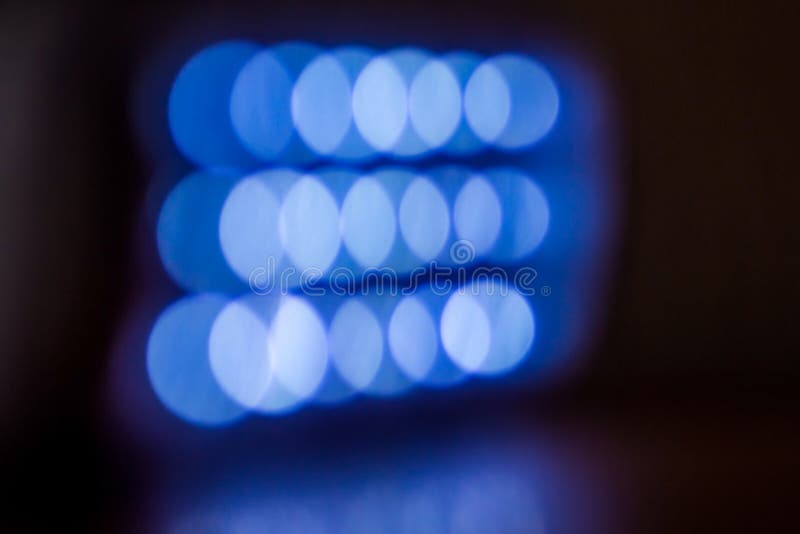 Bright White Fuzzy Lights Glow and Shine on a Dark Background_ Stock ...