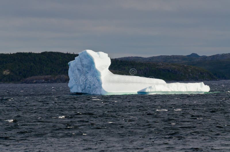 Bright white iceberg stock image. Image of dusk, ocean - 282157259