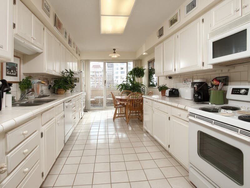 A Bright White Kitchen Interior with Modern Appliances Stock Image ...