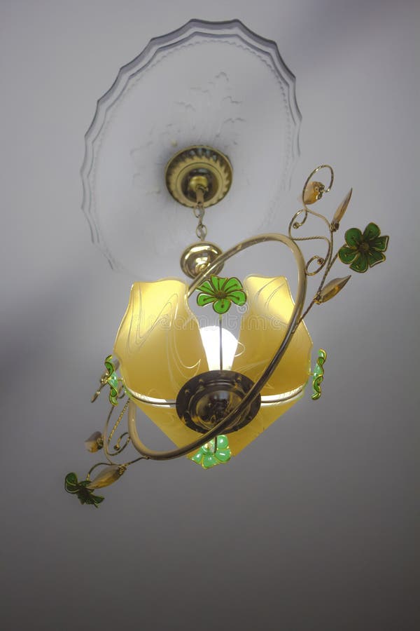 Bright yellow chandelier stock photo. Image of luminary - 67537110