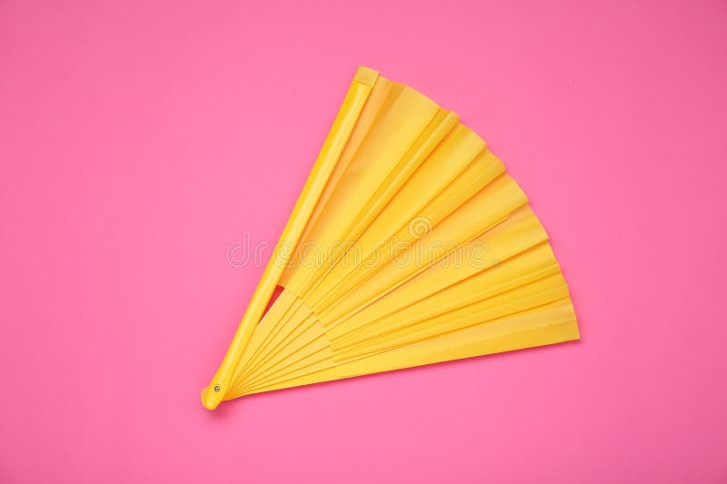 Bright Yellow Hand Fan on Pink Background, Top View Stock Photo - Image ... Bright Yellow Hand Fan on Pink Background, Top View Stock Photo - Image ...