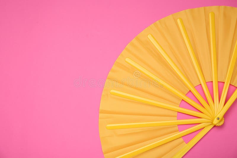Bright Yellow Hand Fan on Pink Background, Top View. Space for Text ...