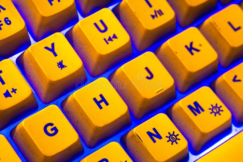 Bright Yellow Keyboard with Blue Light Ambience Stock Image - Image of ...