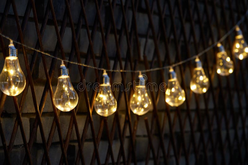 Bright Yellow Lights Hanging in the Night Garden Stock Photo - Image of ...