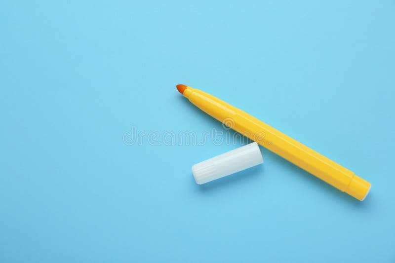Bright Yellow Marker and Cap on Light Blue Background, Flat Lay. Space ...