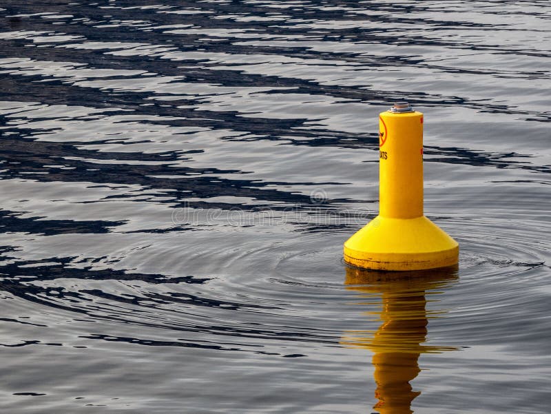 Bright Yellow Navigation Buoy is Seen in Contrast To Wave Patterns ...